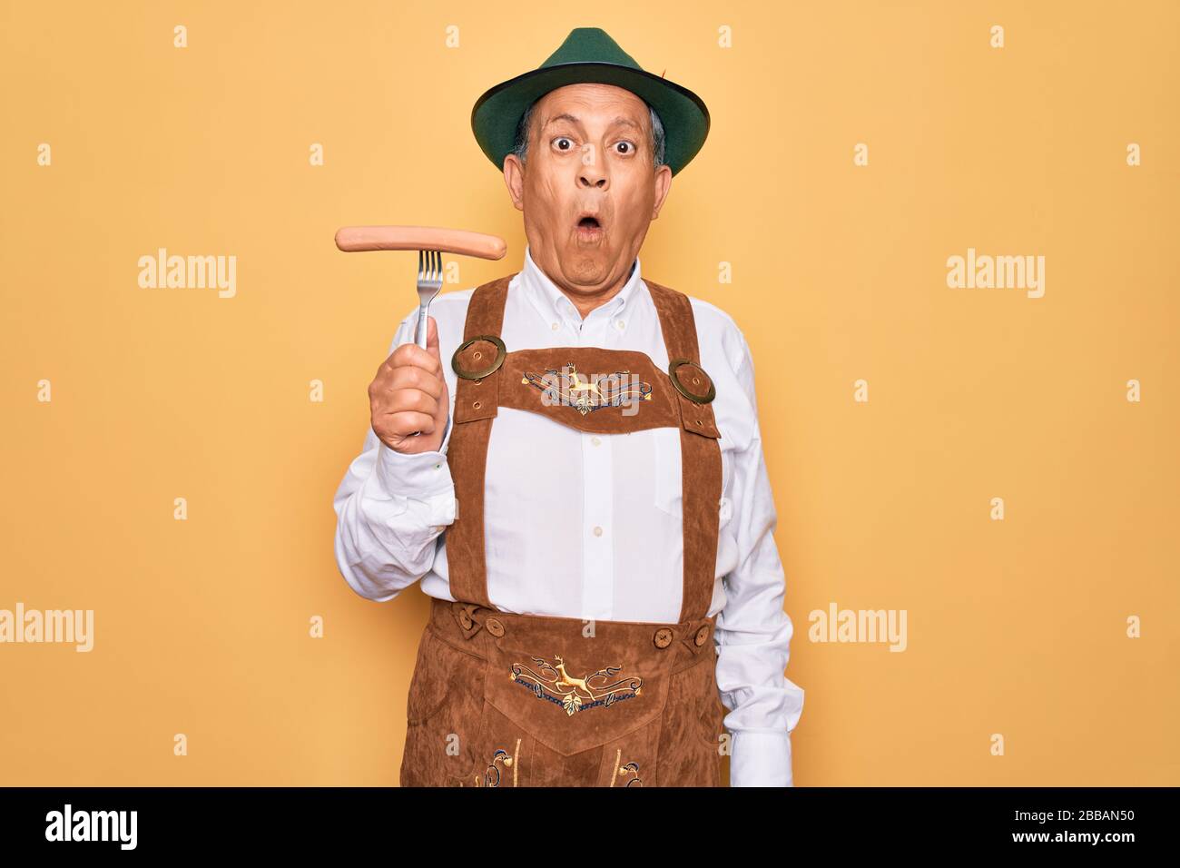 Senior grey-haired man wearing german traditional octoberfest suit ...