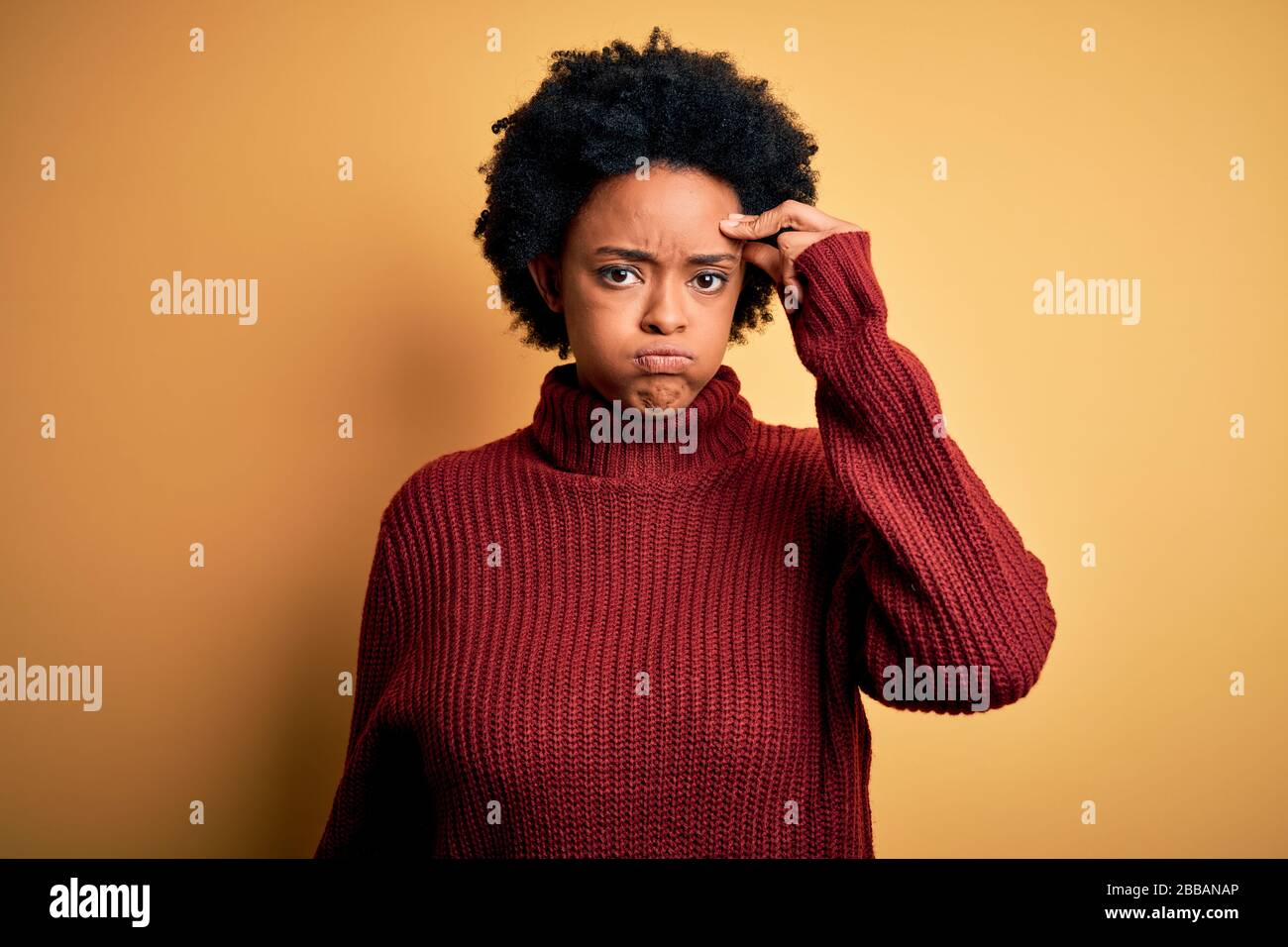 Young beautiful African American afro woman with curly hair wearing ...