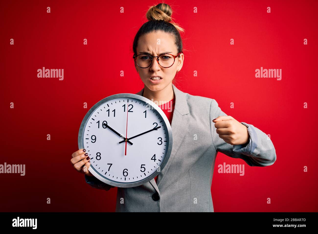 Beautiful blonde woman with blue eyes wearing glasses doing countdown ...