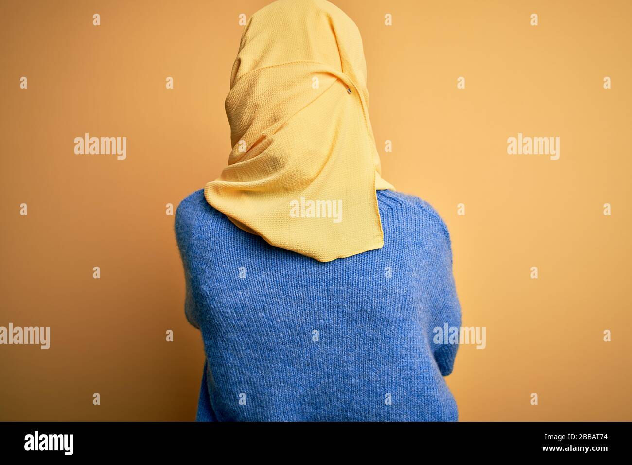 Young beautiful brunette muslim woman wearing arab hijab over isolated ...