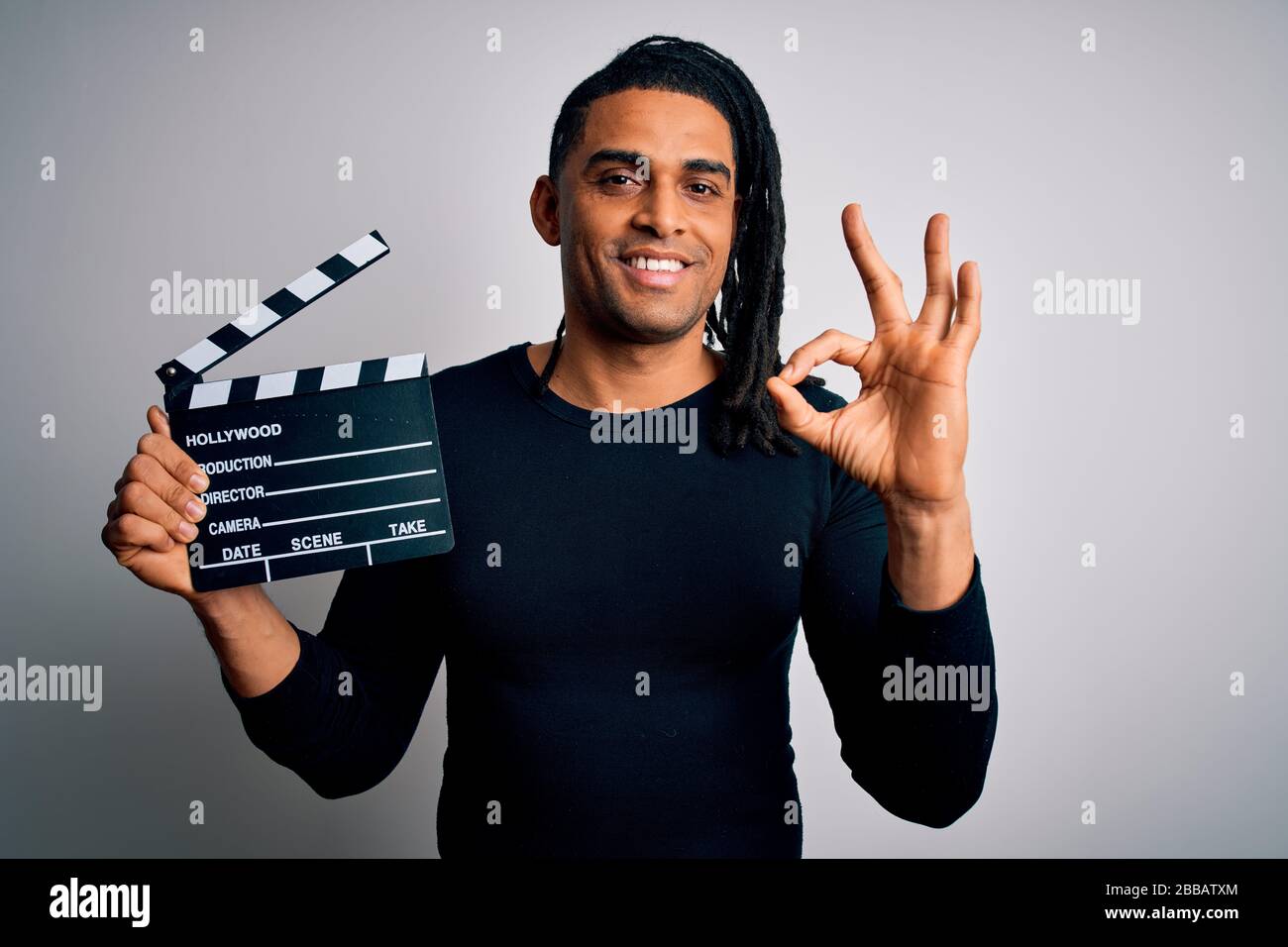 Young african american afro director man making movie using clapboard ...