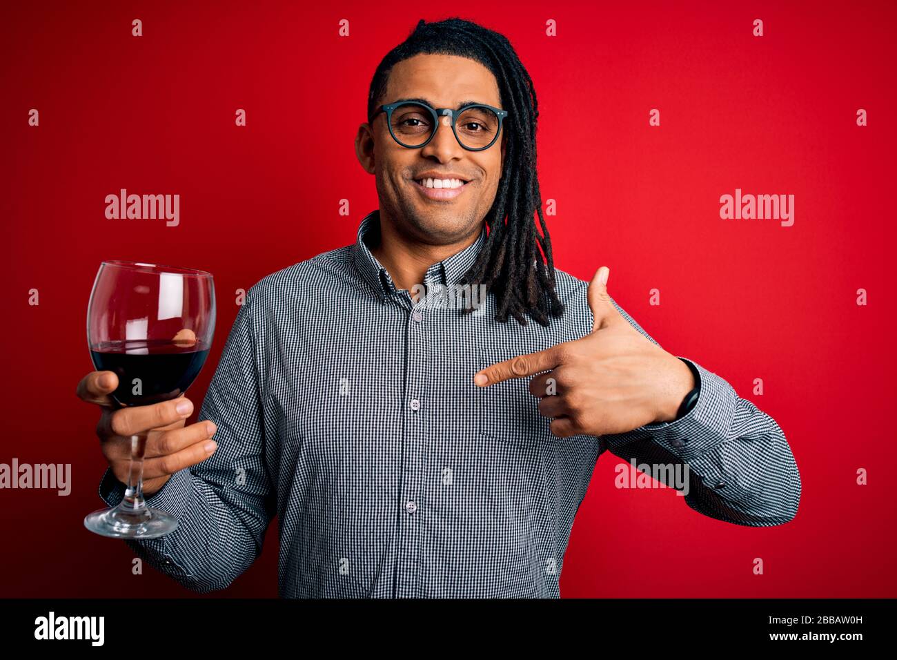 Young african american afro sommelier man with dreadlocks drinking ...