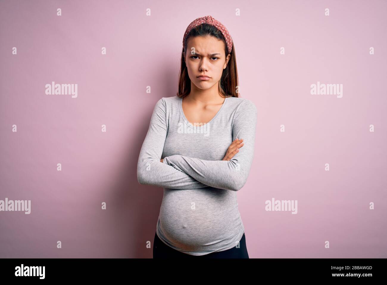 Young beautiful teenager girl pregnant expecting baby over isolated ...