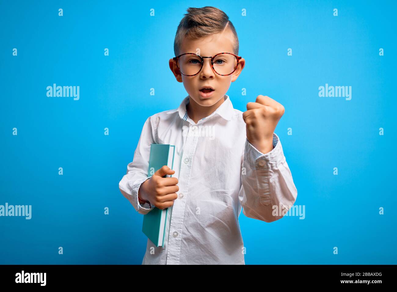 Young little caucasian student kid wearing smart glasses and holding a ...