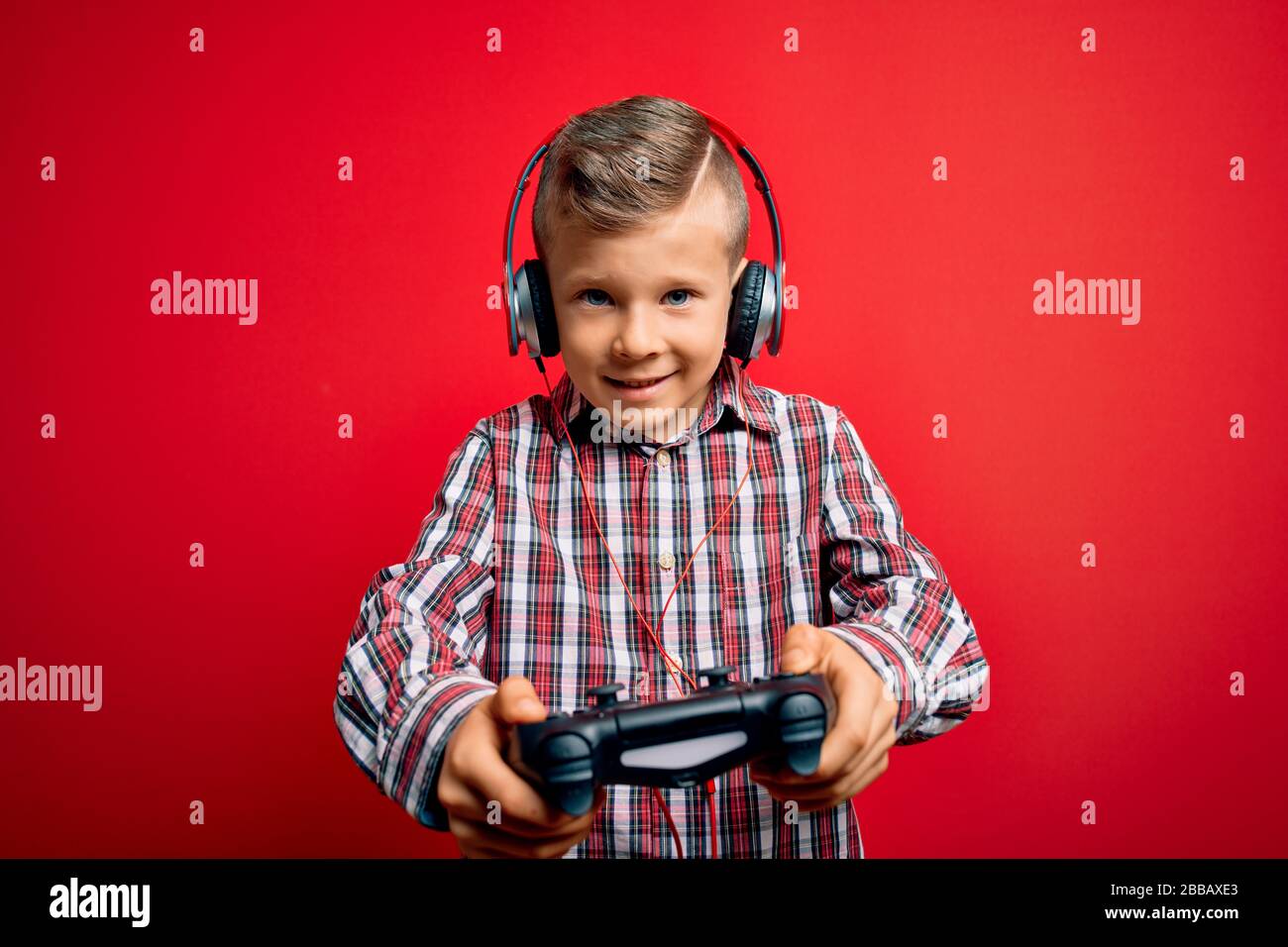 Adorable blond gamer toddler smiling happy and confident. Standing with ...