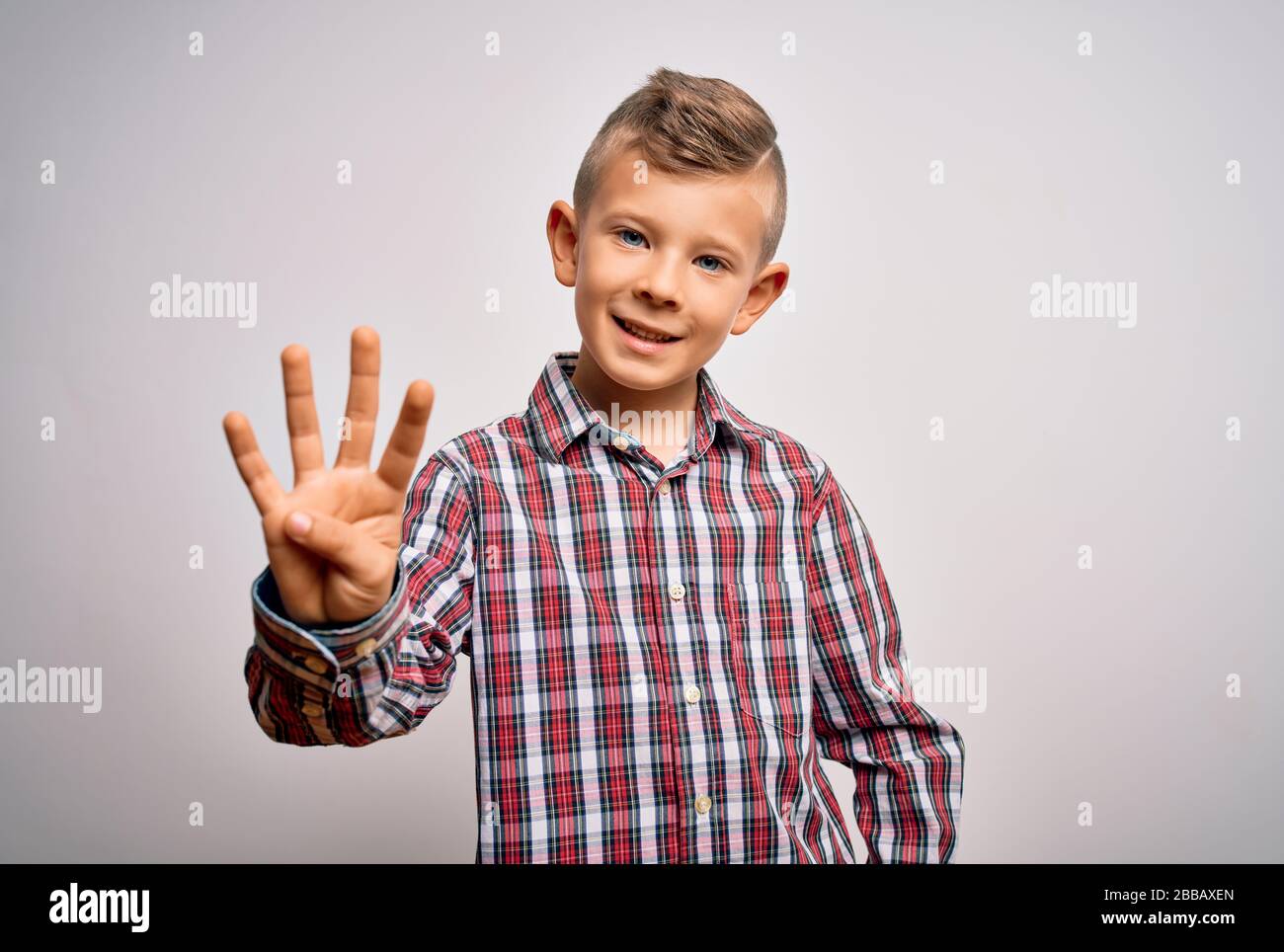 Young little caucasian kid with blue eyes wearing elegant shirt ...