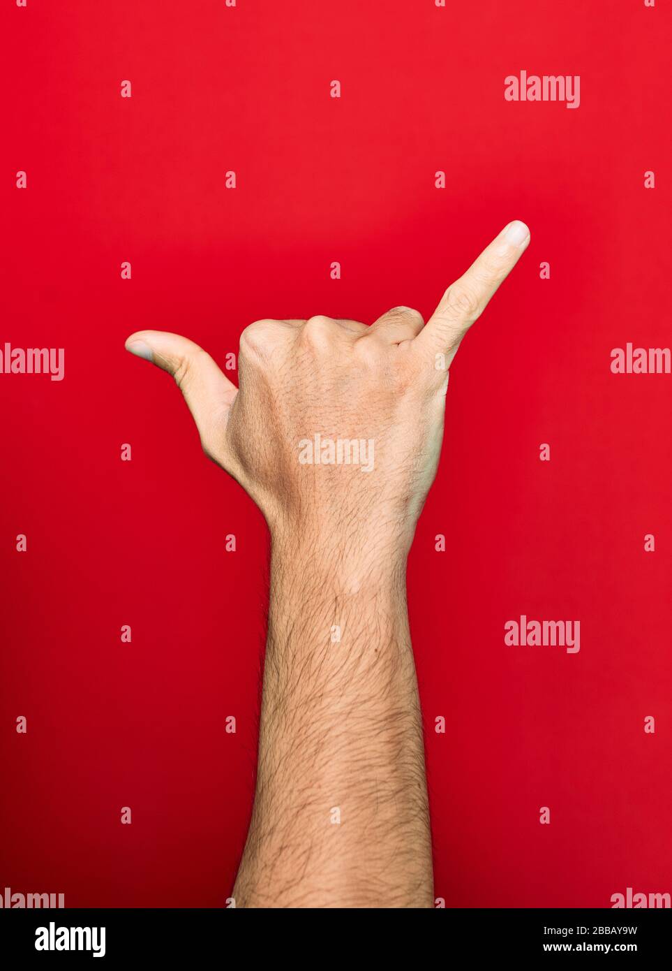 Beautiful hand of man doing surf symbol with thum and pinkie finger up ...