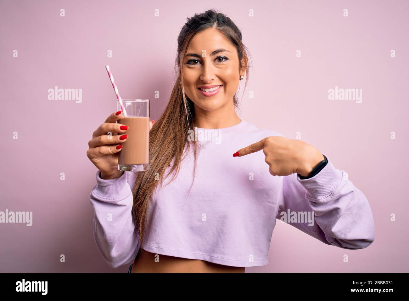 Beautiful woman drinking pink milkshake hi-res stock photography and ...