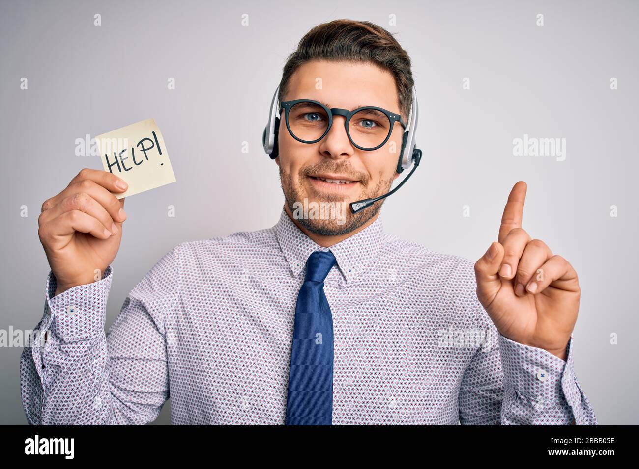 Young call center operator business man with blue eyes offering support ...