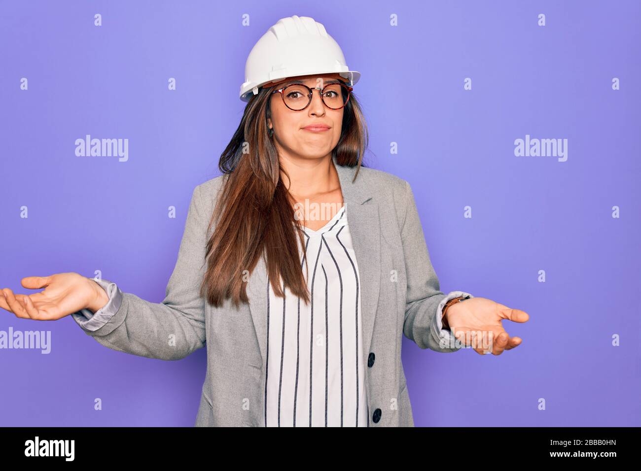 Professional woman engineer wearing industrial safety helmet over ...