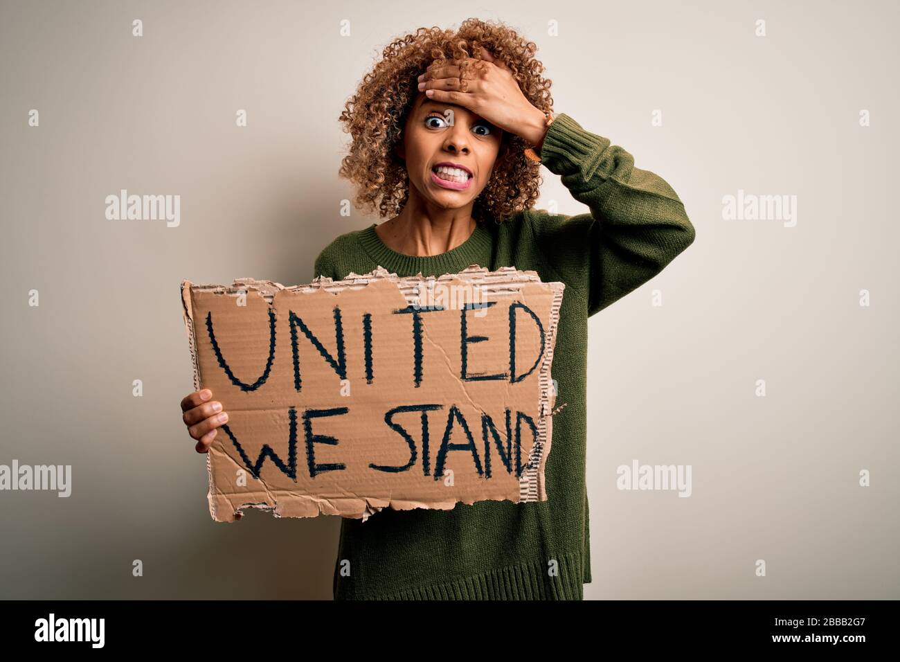 African american activist woman asking for unity holding banner with ...