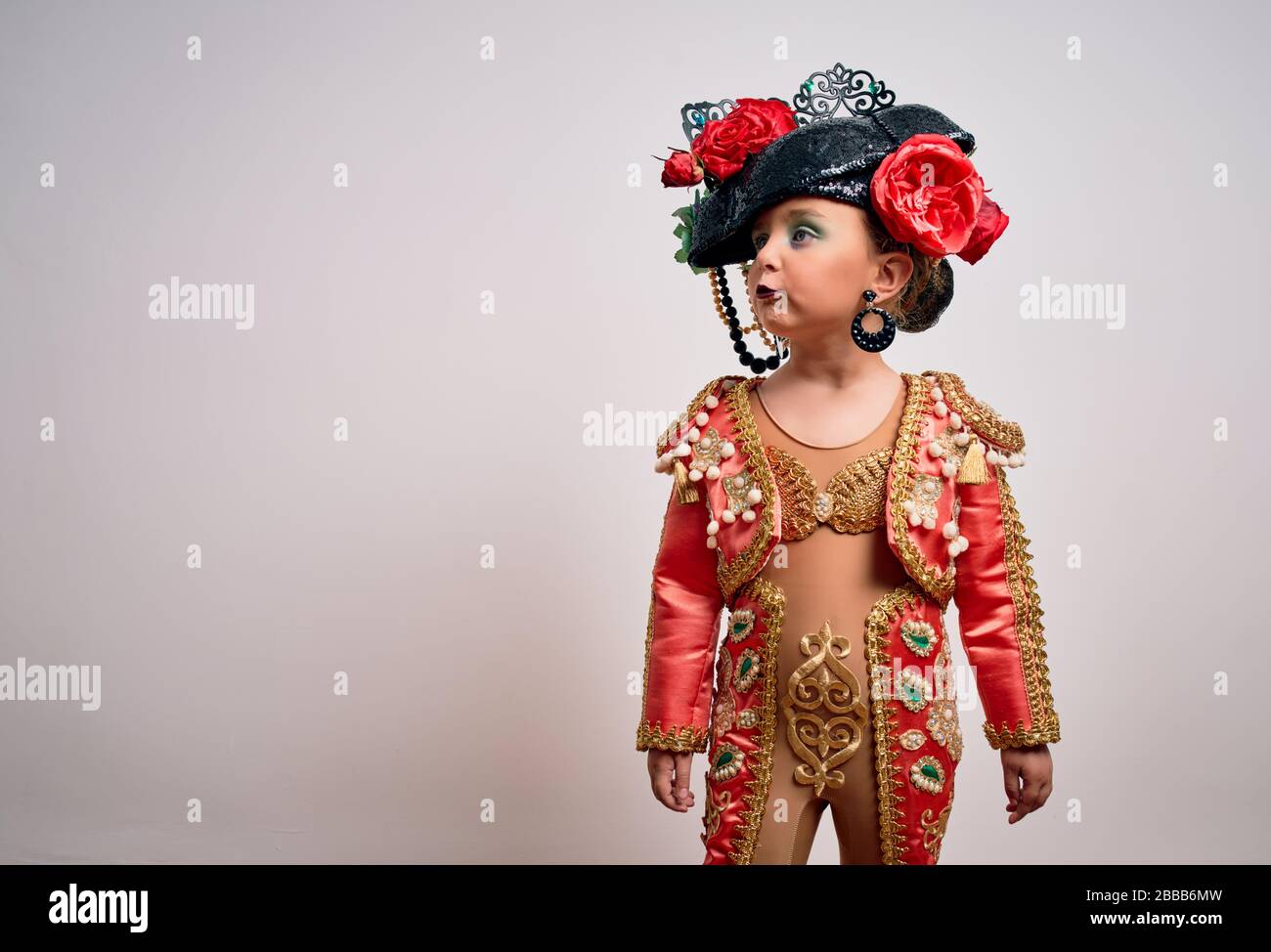 Young little caucasian kid girl wearing bullfighter traditional folkore ...