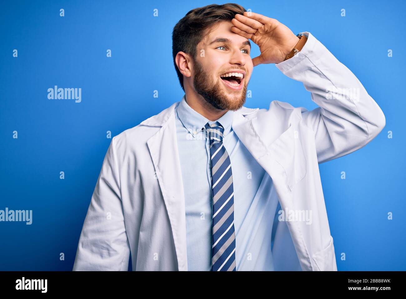 Young blond therapist man with beard and blue eyes wearing coat and tie ...