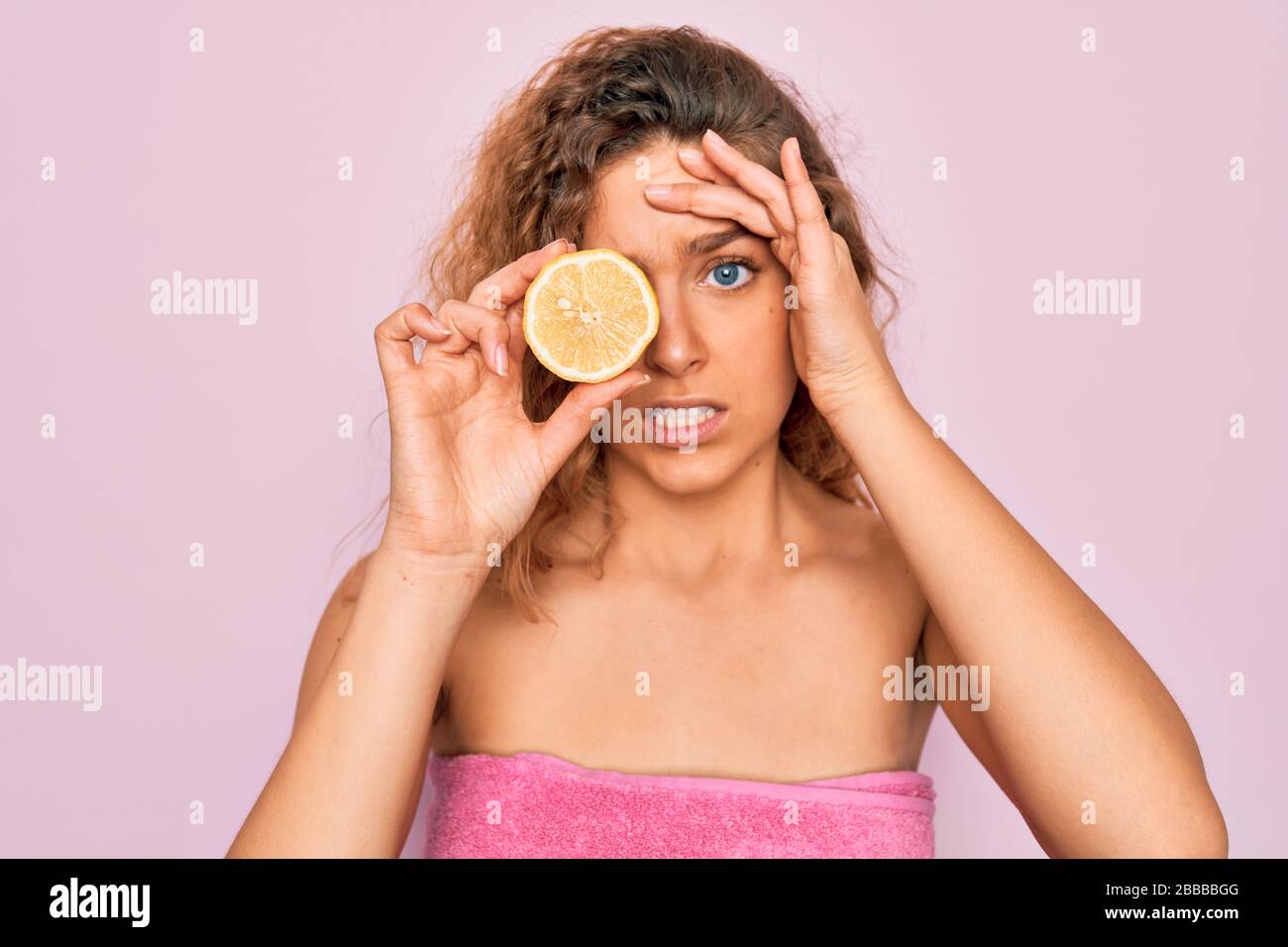 Beautiful woman with blue eyes wearing towel shower after bath holding ...