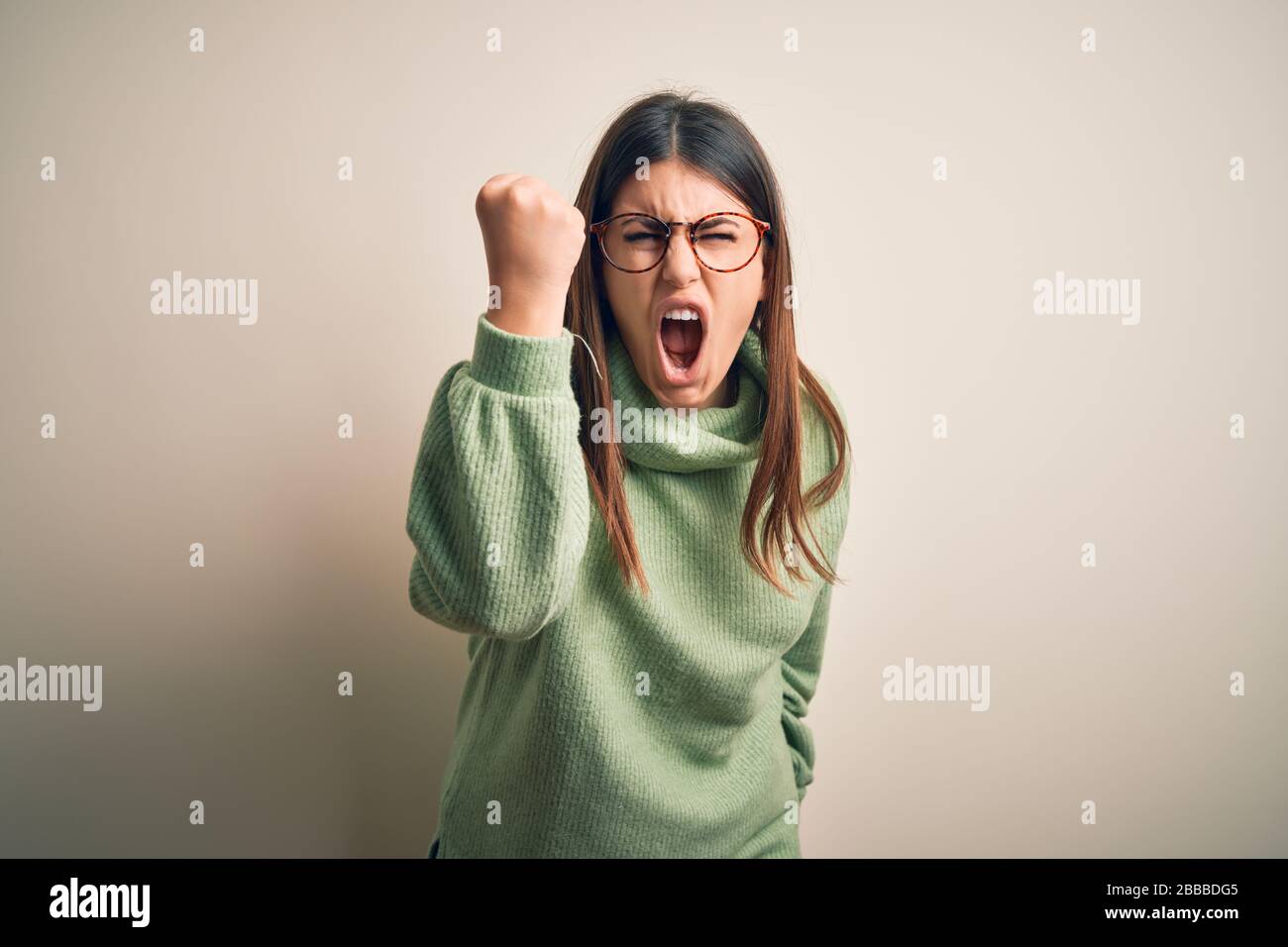 Young beautiful woman wearing casual sweater standing over isolated ...