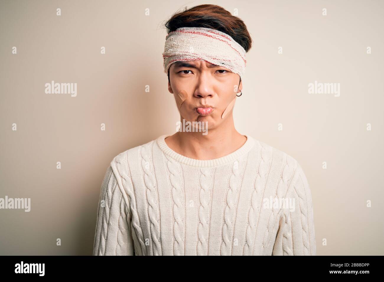 Young handsome chinese man injured for accident wearing bandage and ...