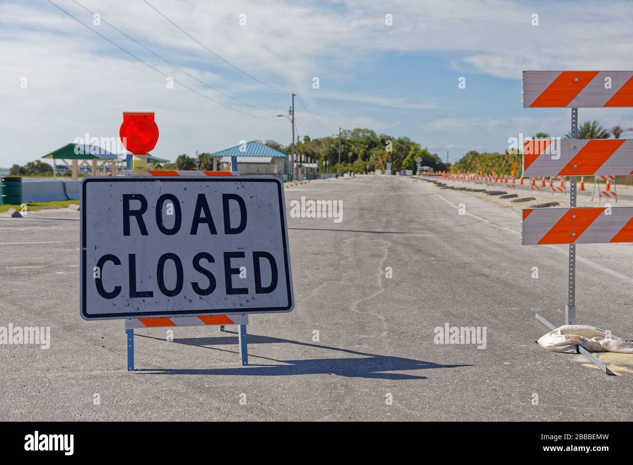 Road closed sign, with barricades and traffic cones, posted at Citrus ...