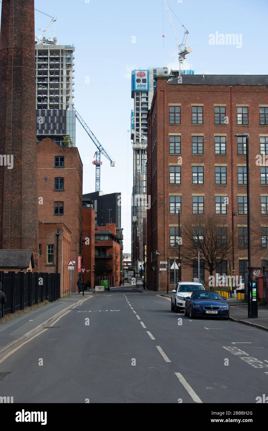 Hulme street, Manchester city centre. Cranes and building works in ...