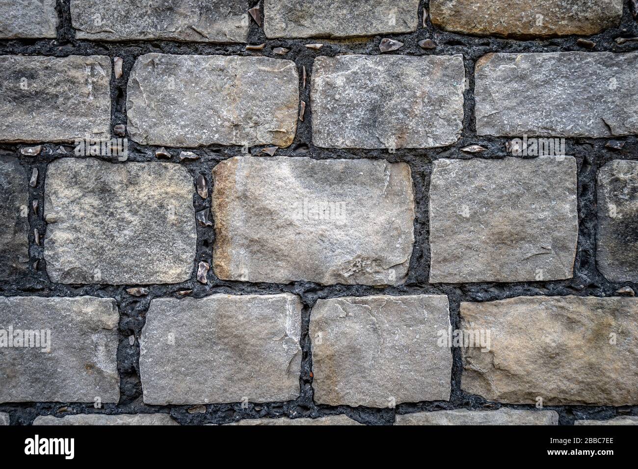 Medieval grey brick wall pattern Stock Photo - Alamy