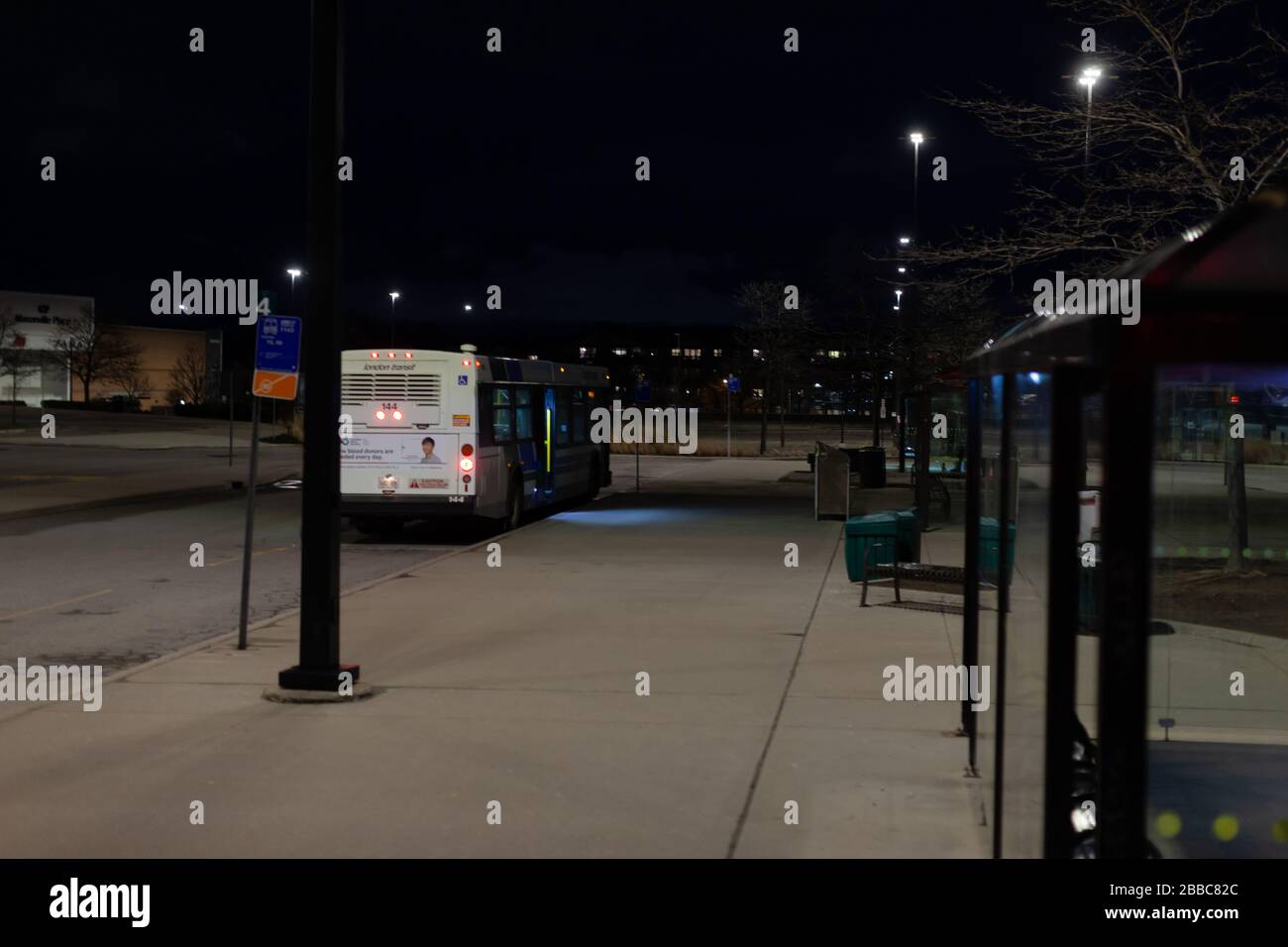 London Transit Commission buses, sit and wait at an empty transit hub ...