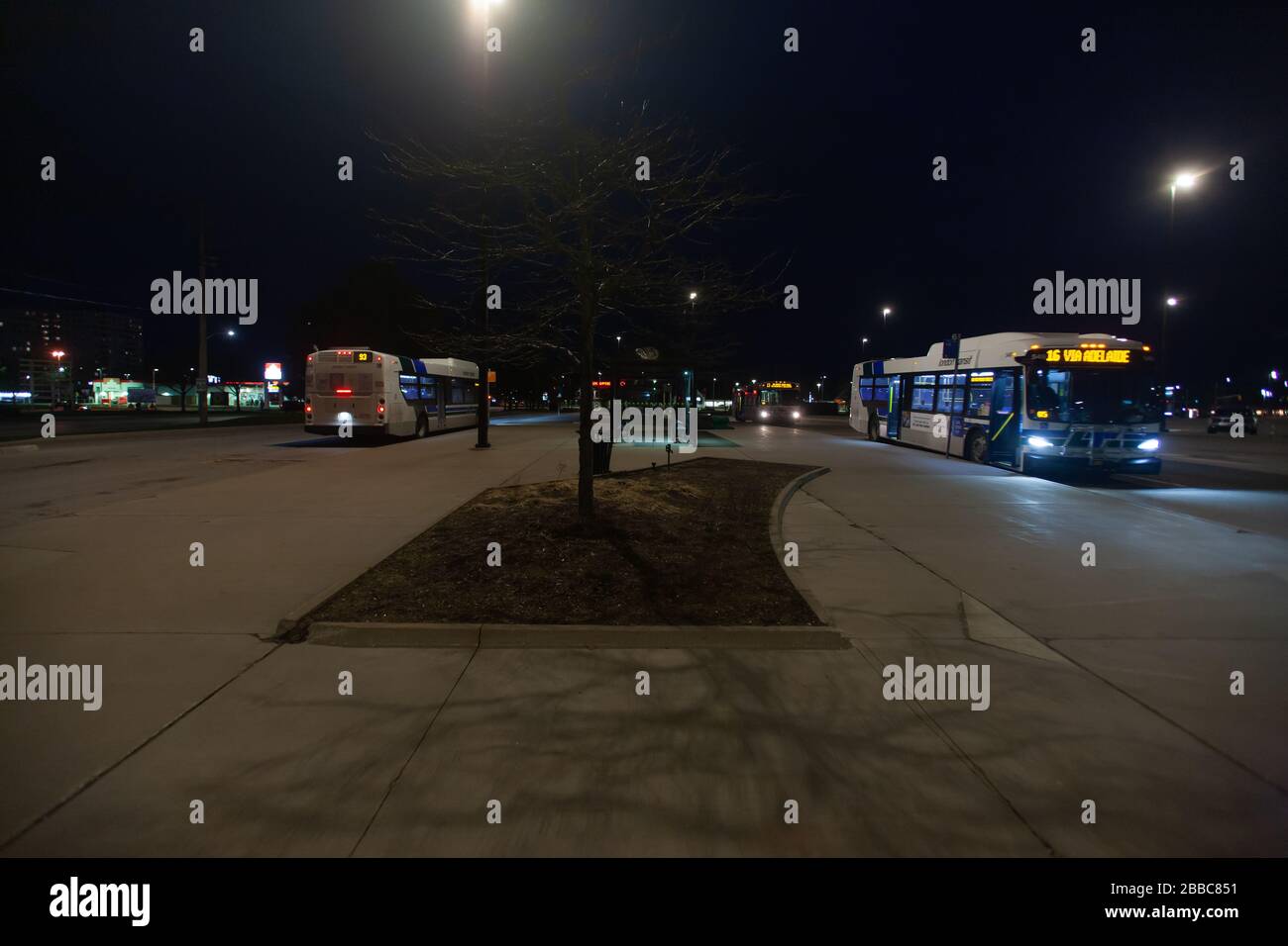 London Transit Commission buses, sit and wait at an empty transit hub ...