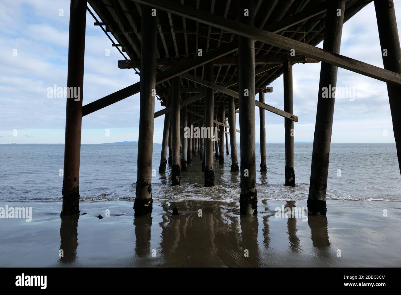 The Pacific Ocean seen from beneath a pier Stock Photo - Alamy