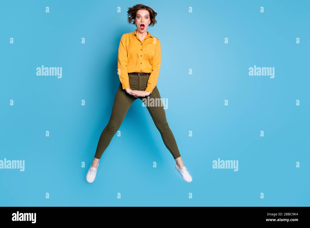 Full length photo of pretty business lady jumping high up open mouth ...