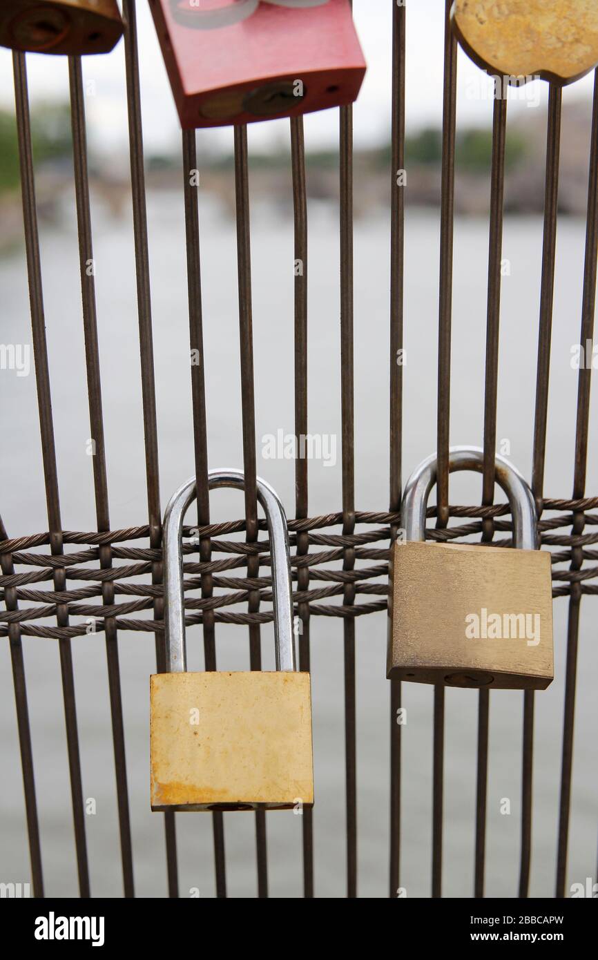 Padlock with the Eiffel Tower carving hanging on the fence of ...