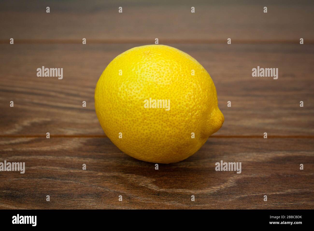 Lemon citrus healthy product on a woody background close up delicious ...