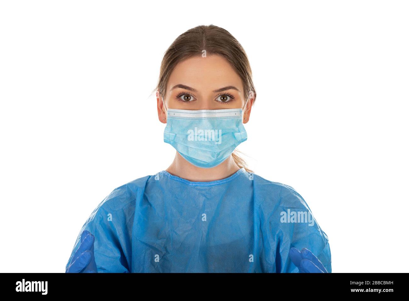 Young medical nurse wearing blue protective uniform on isolated ...