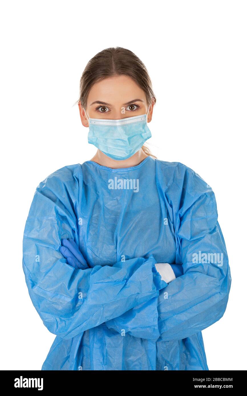Young medical nurse wearing blue protective uniform on isolated ...