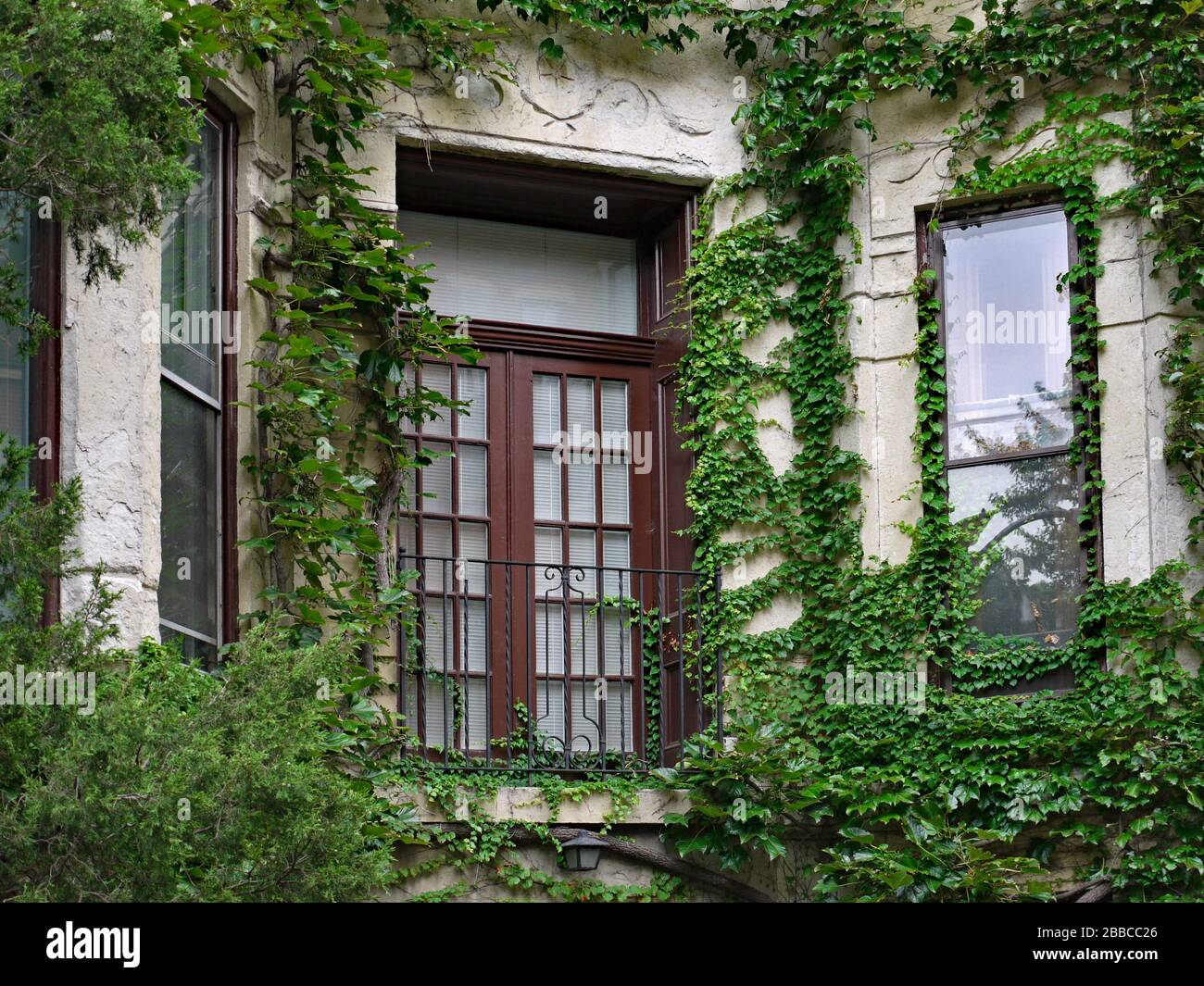 French door type window opening to balcony in old apartment building ...