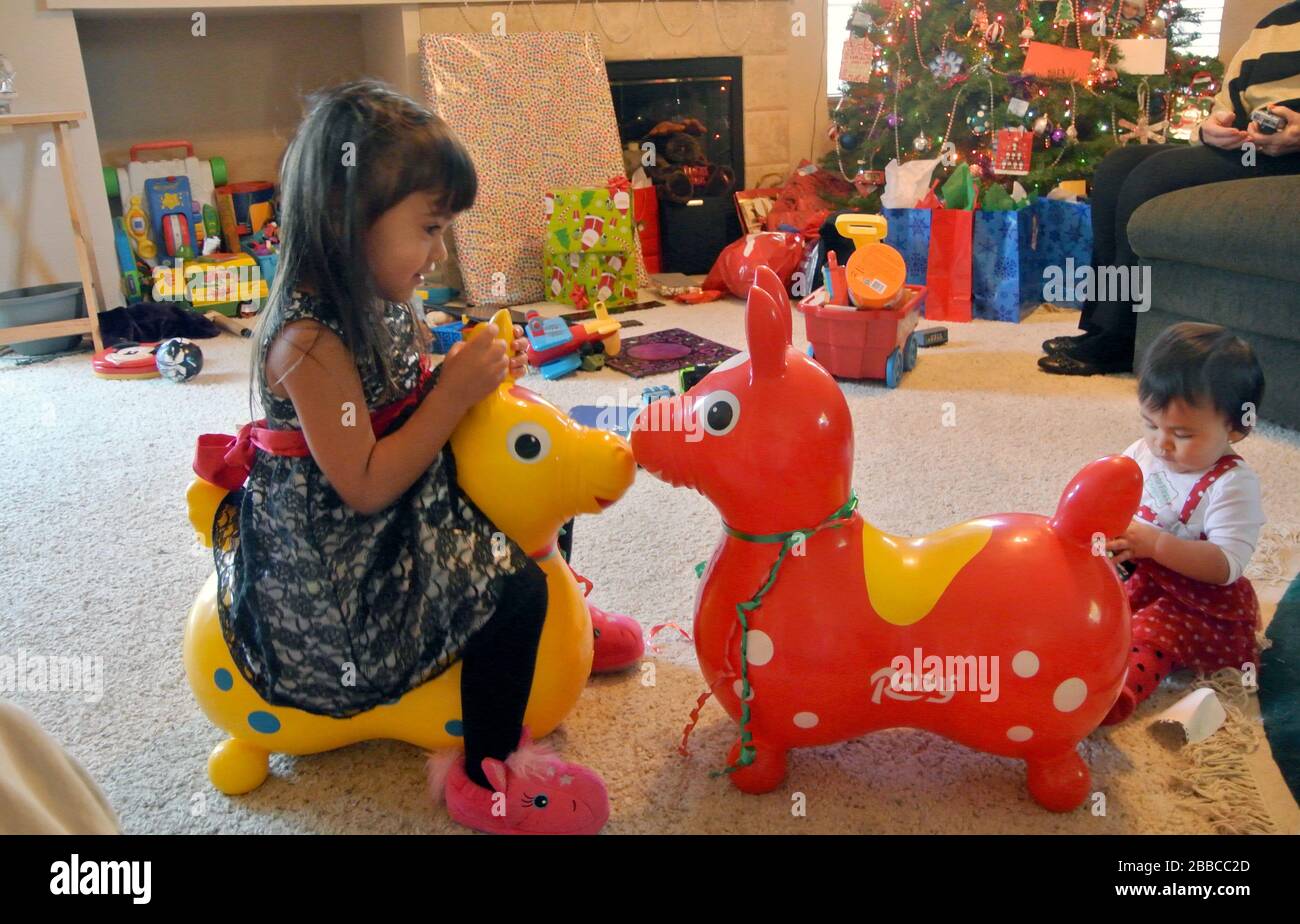 kids play with toys on christmas morning Stock Photo - Alamy