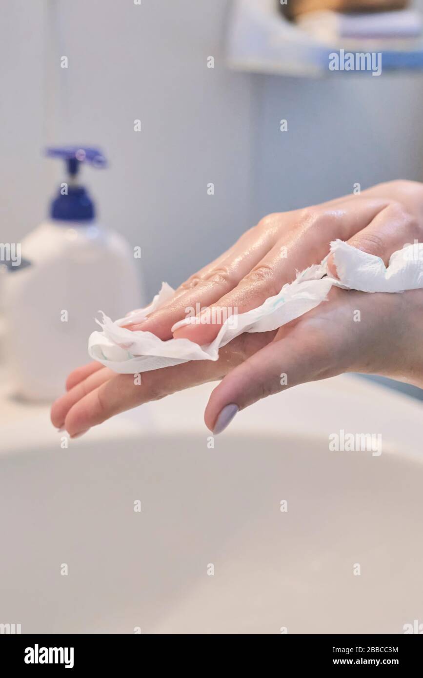 Close-up view of an unrecognizable female showing how to wash hands ...