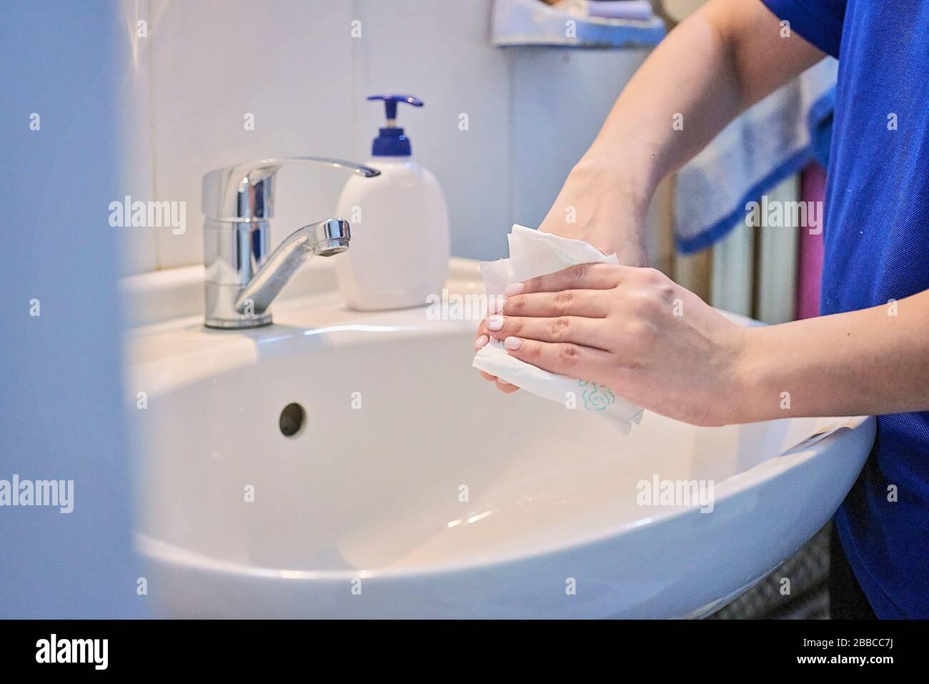 Close-up view of an unrecognizable female showing how to wash hands ...