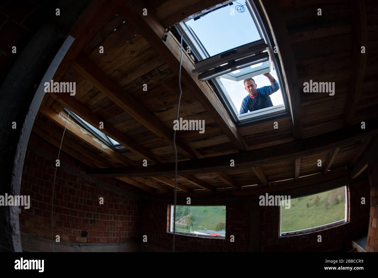 construction worker installing environmentally friendly and energy ...