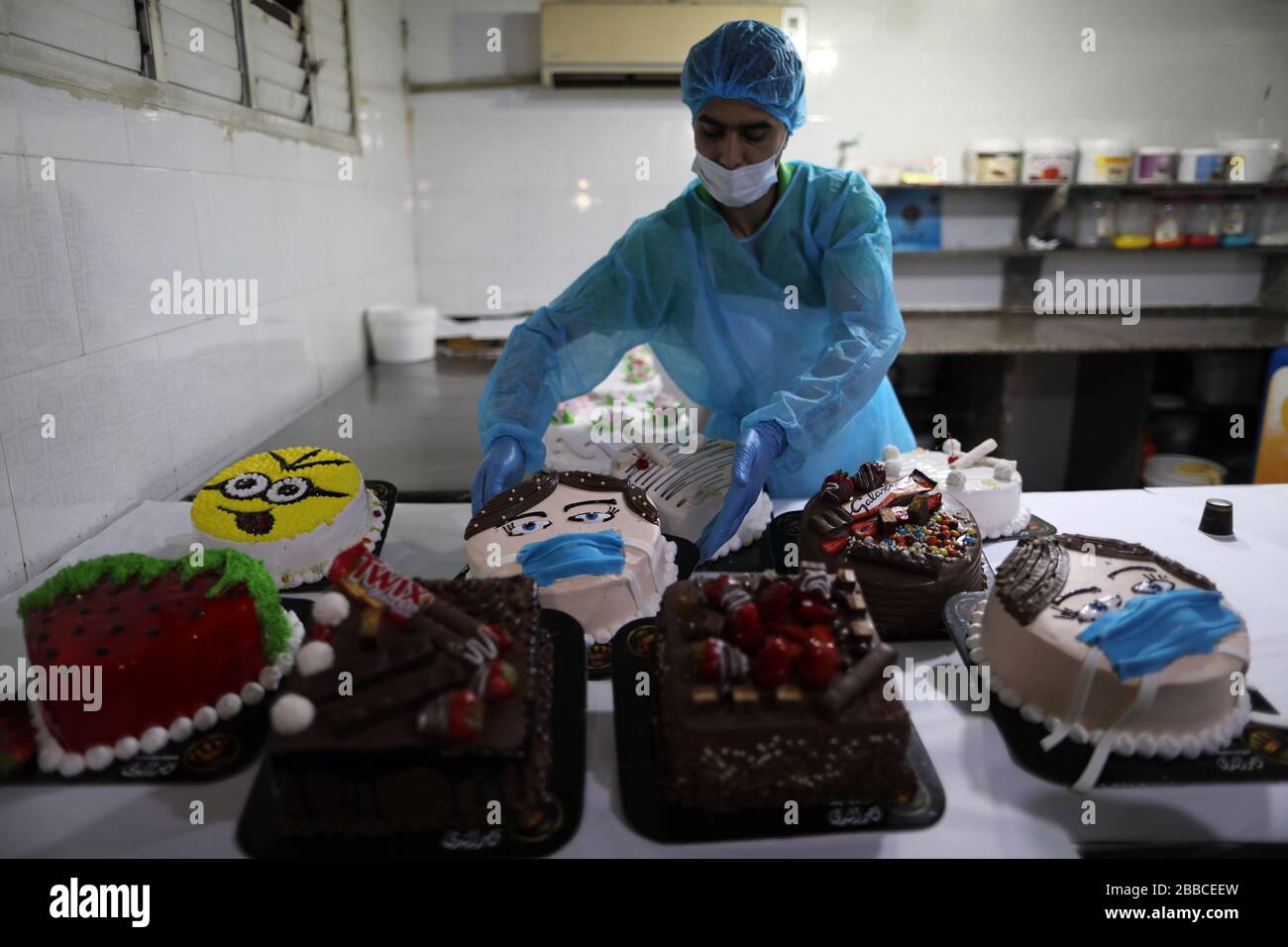 Gaza. 30th Mar, 2020. A Palestinian baker makes cakes at his bakery in ...