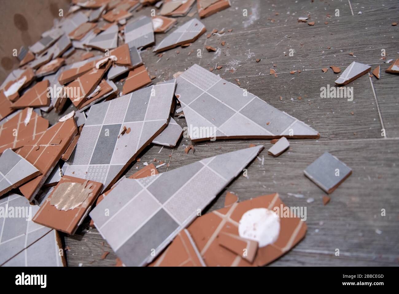 Pile of broken ceramic tiles remains after bathroom renovation prepared ...