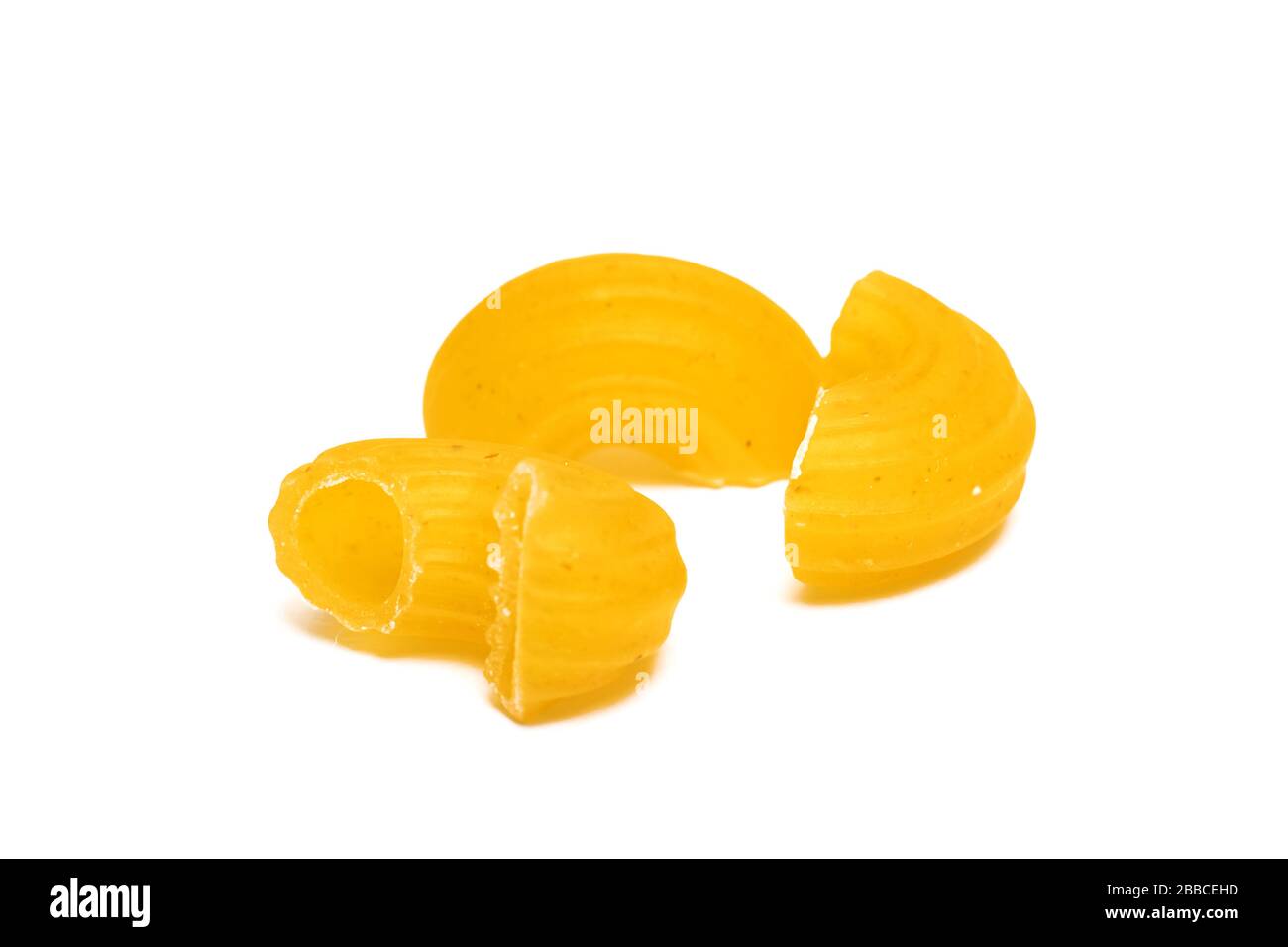 Yellow pasta isolated on a white background Stock Photo - Alamy