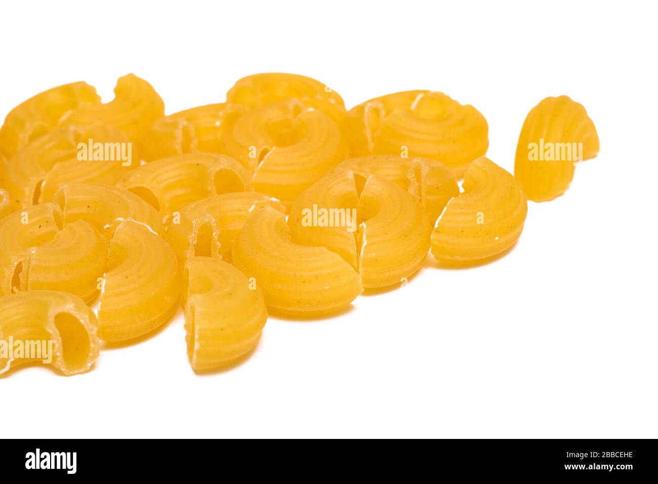 Yellow pasta isolated on a white background Stock Photo - Alamy