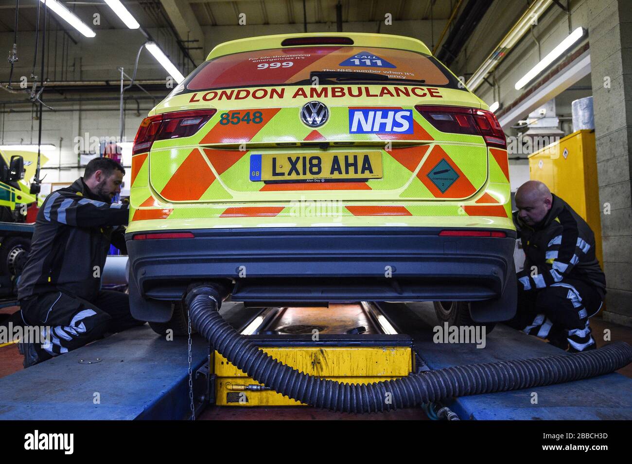 AA mechanics check the tires of an ambulance, at the London Ambulance ...