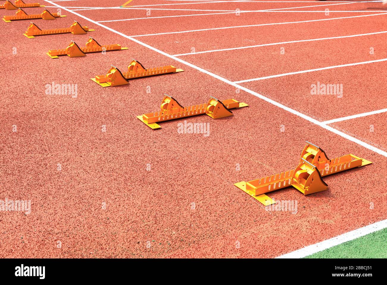 Starting blocks on the playground of the runway Stock Photo - Alamy