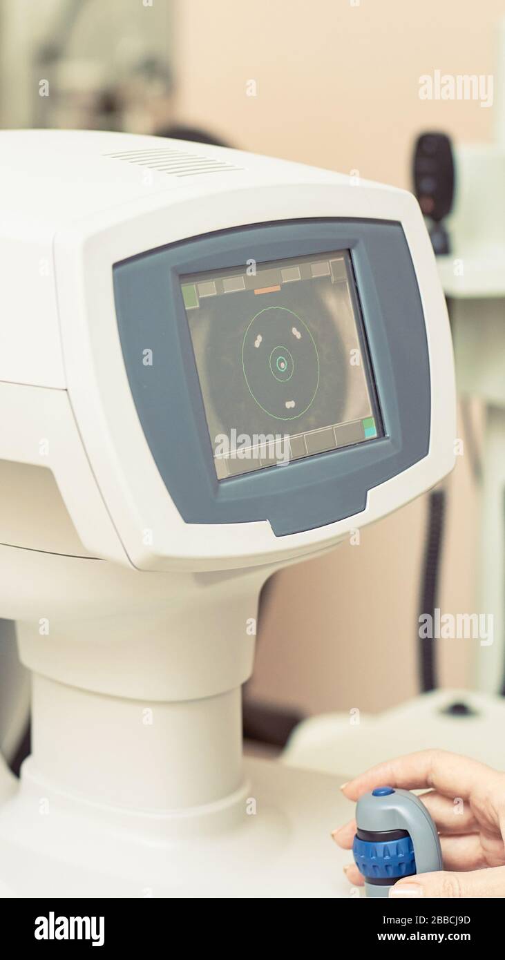 ophthalmologist doctor in exam optician laboratory. Men eye care ...