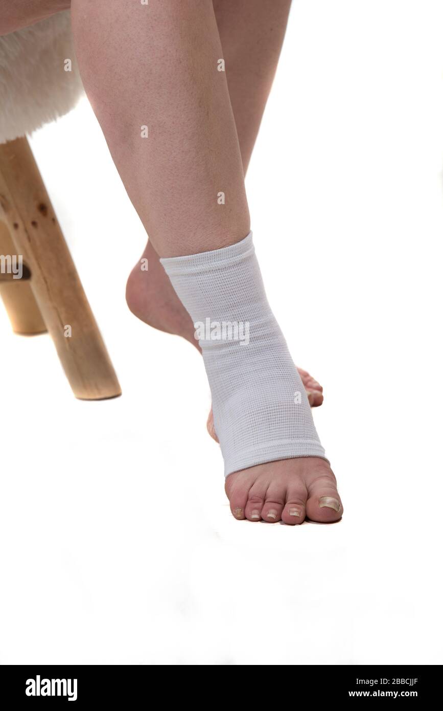 Woman leg with ankle support isolated on white background Stock Photo ...