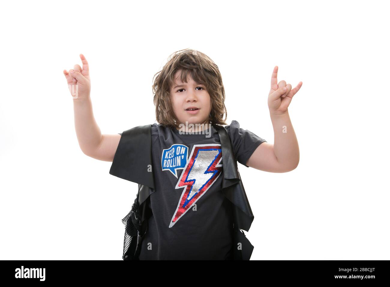 Rocker kid boy showing rock and roll sign fingers isolated on white ...