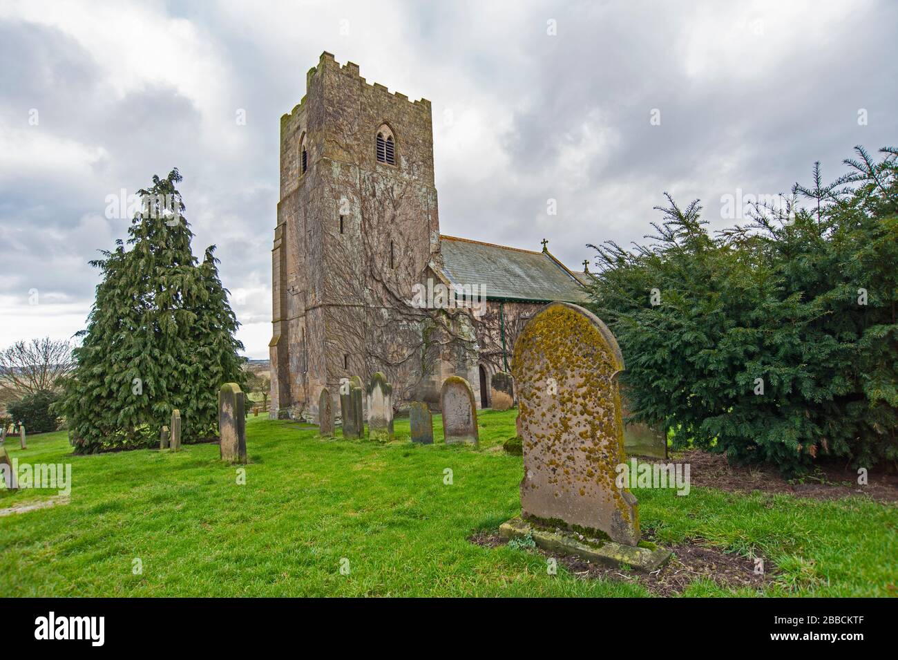 Old church and graveyard in an english rural countryside community ...