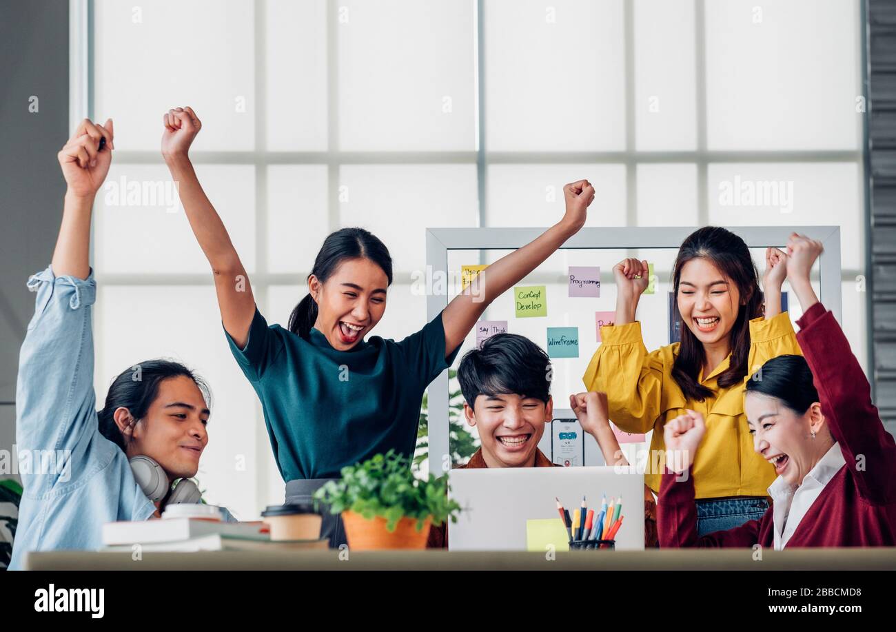 Asian ux developer and ui designer arms raise for successful design at ...