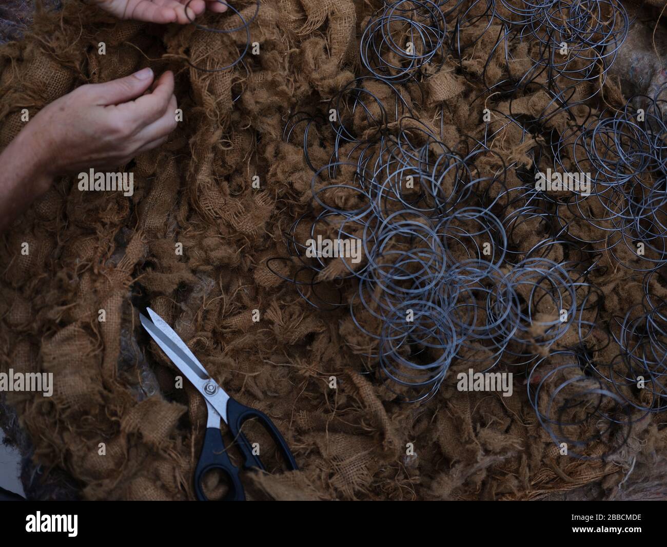 High resolution photograph of a caucasian woman working with metal ...