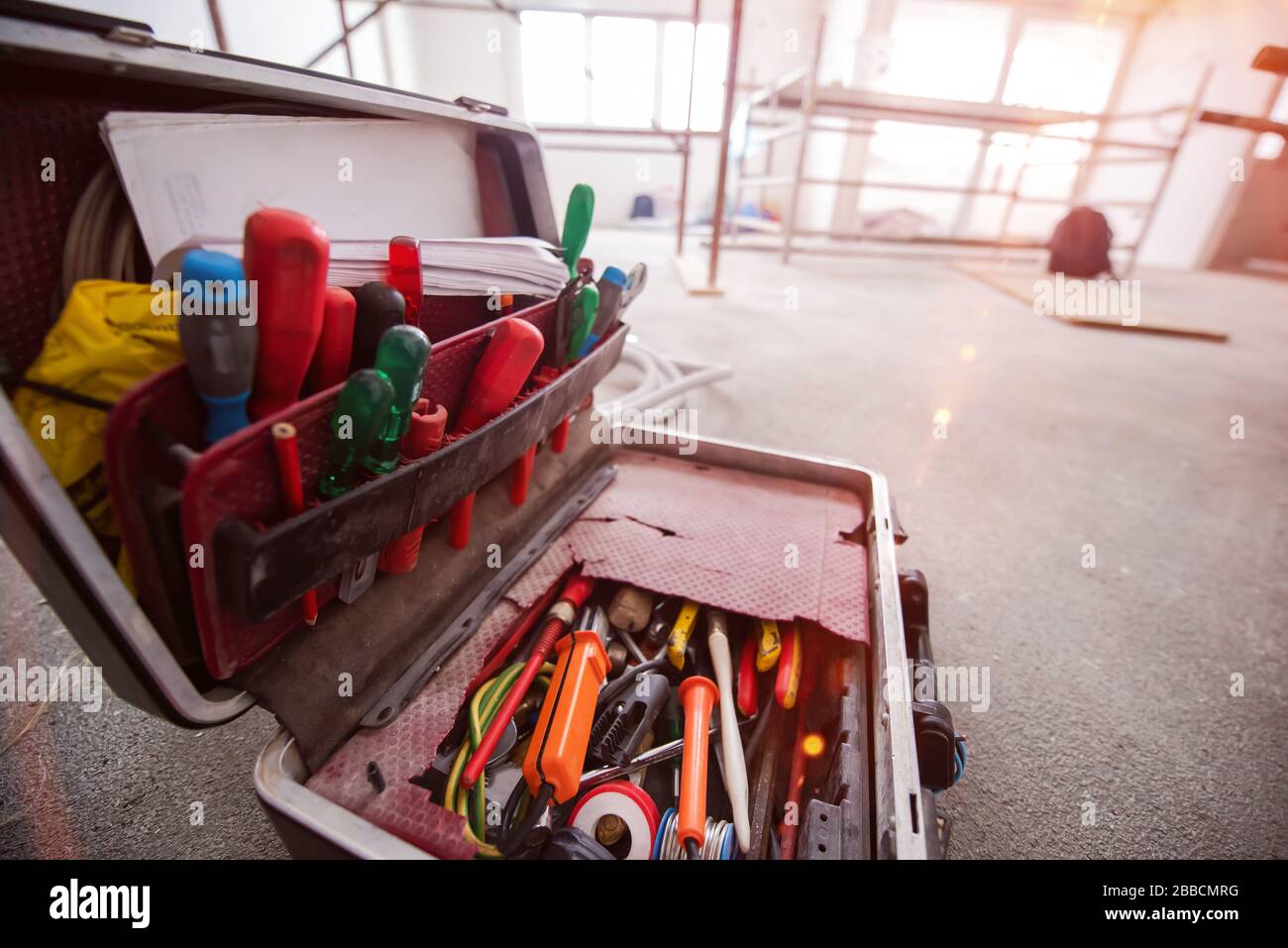 toolbox full of hand tools on real dusty floor background at ...