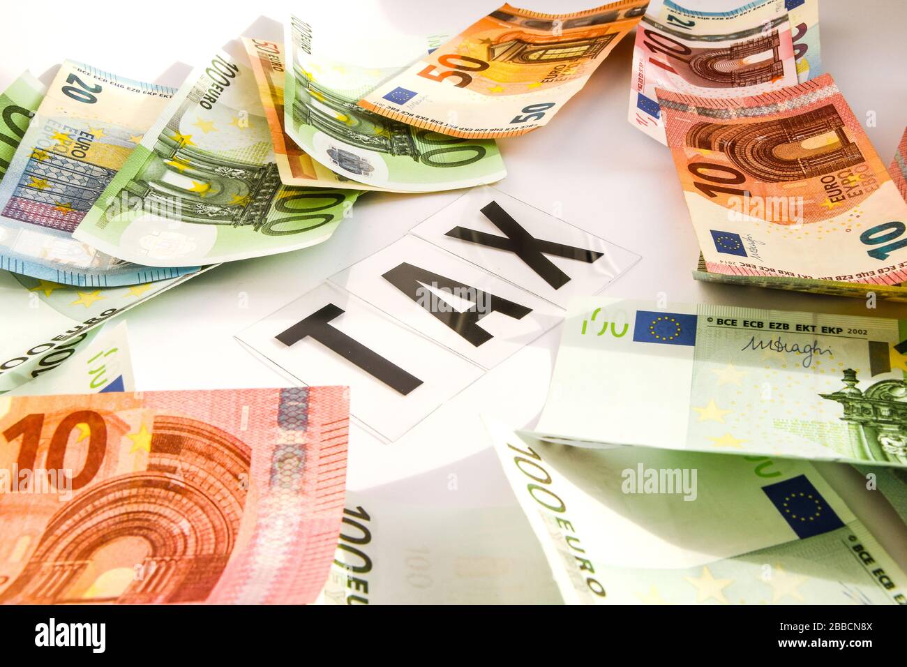 Euro Money Frame with Tax word inside on white background Stock Photo ...